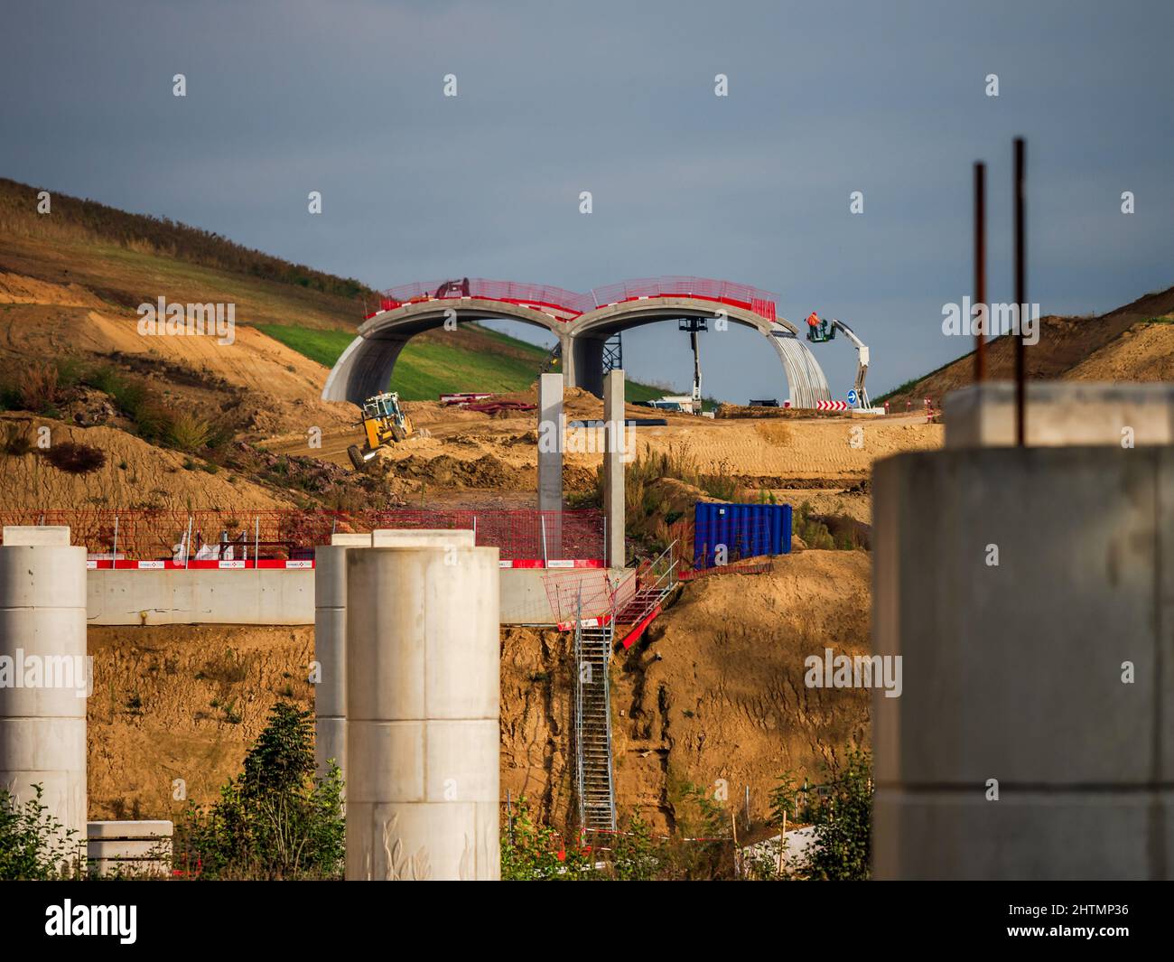 Construction of a new expressway. Bridge supports and new roadbed ...