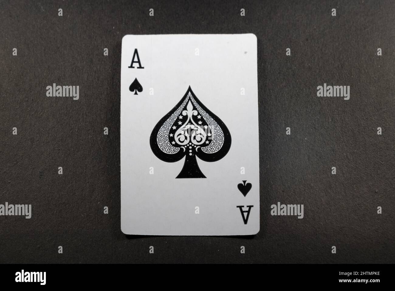 Playing card spades of ace isolated on black background Stock Photo - Alamy