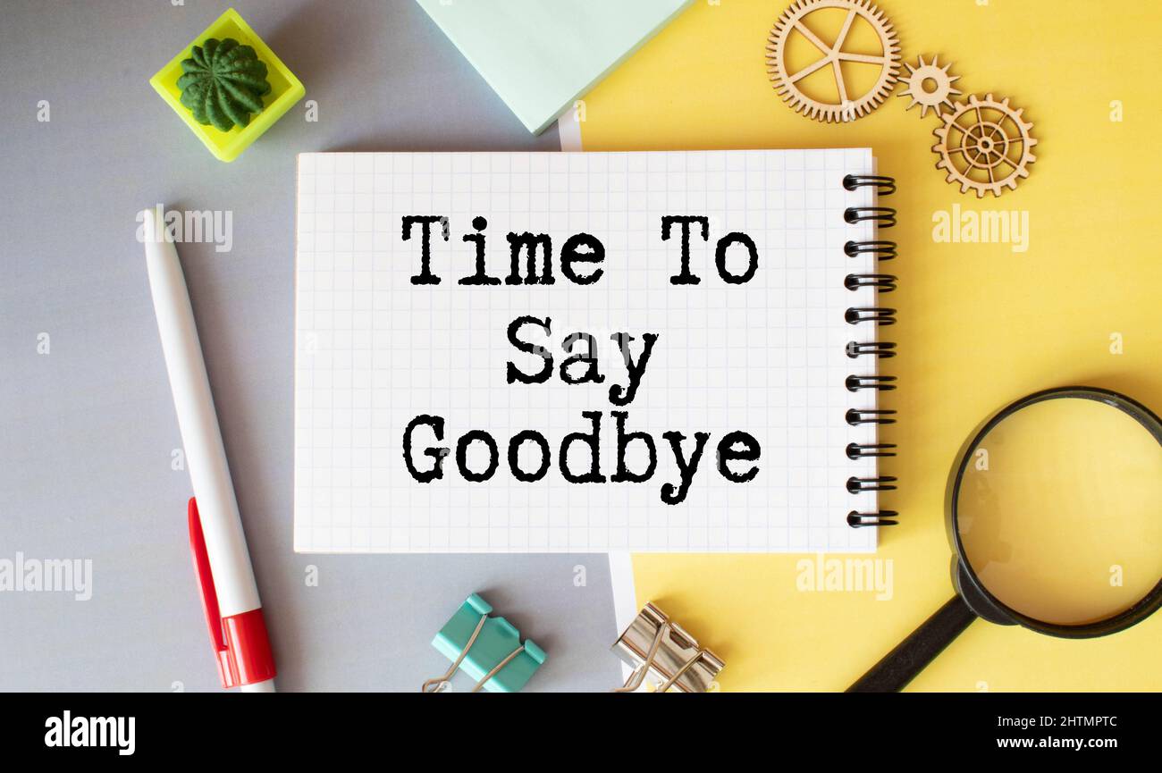 The text Time to say goodbye appearing behind torn brown paper Stock ...