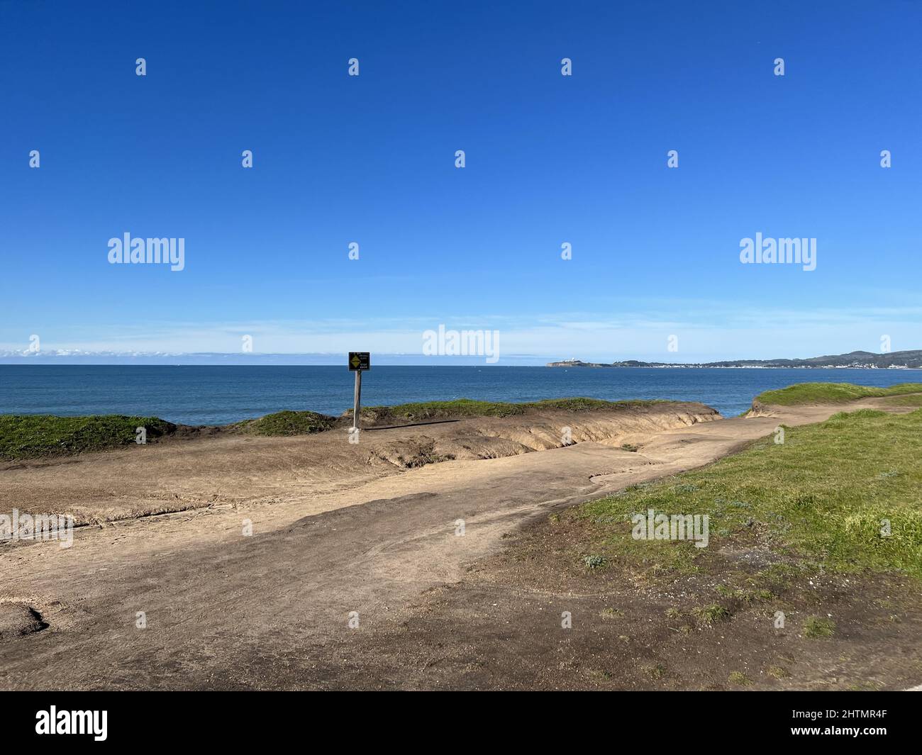 Eroded cliffs are visible near the Half Moon Bay Coastal trail, a ...
