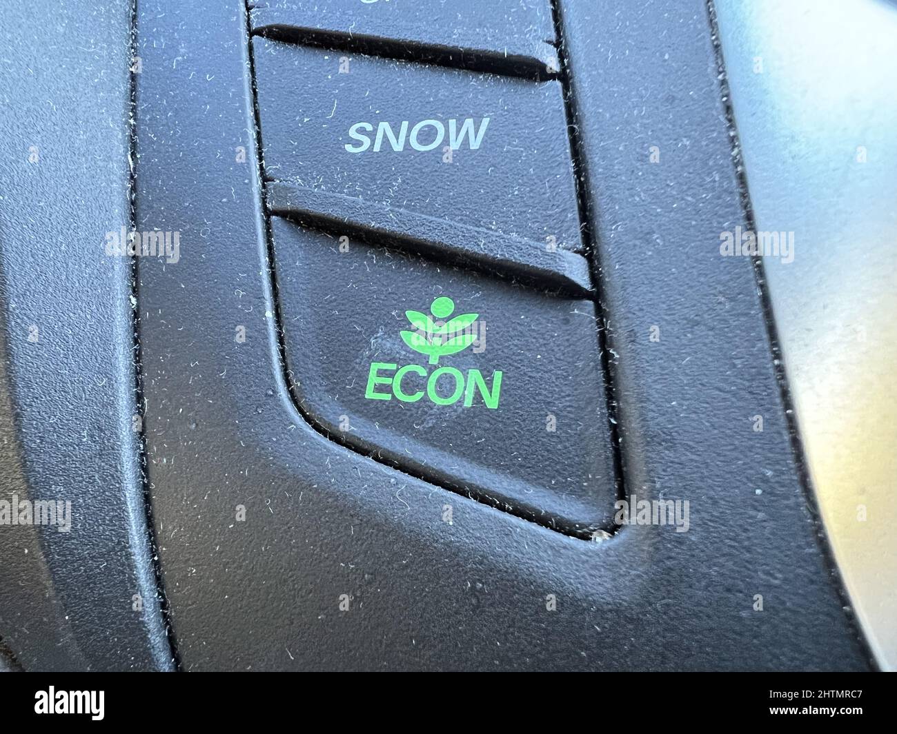 Button and dashboard display for Econ mode, with green leaf icon, in a ...