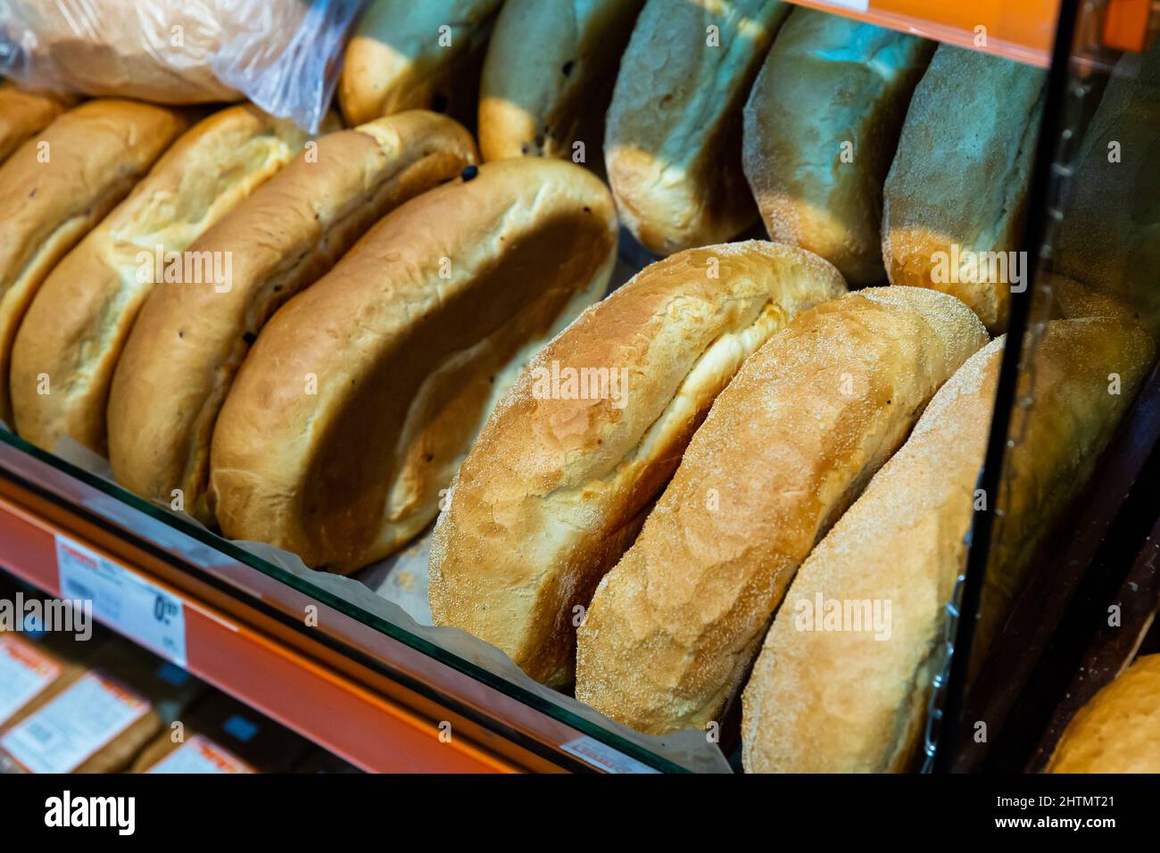 Baguettes on showcase in bakery shop Stock Photo - Alamy