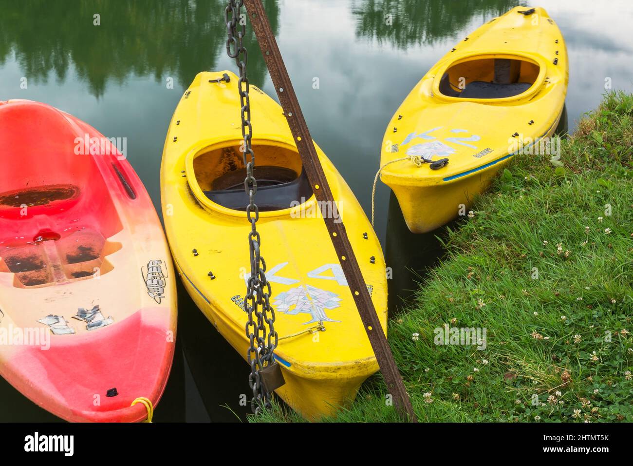 Moored red, orange and yellow fiberglass kayaks, Centre-de-la-Nature ...