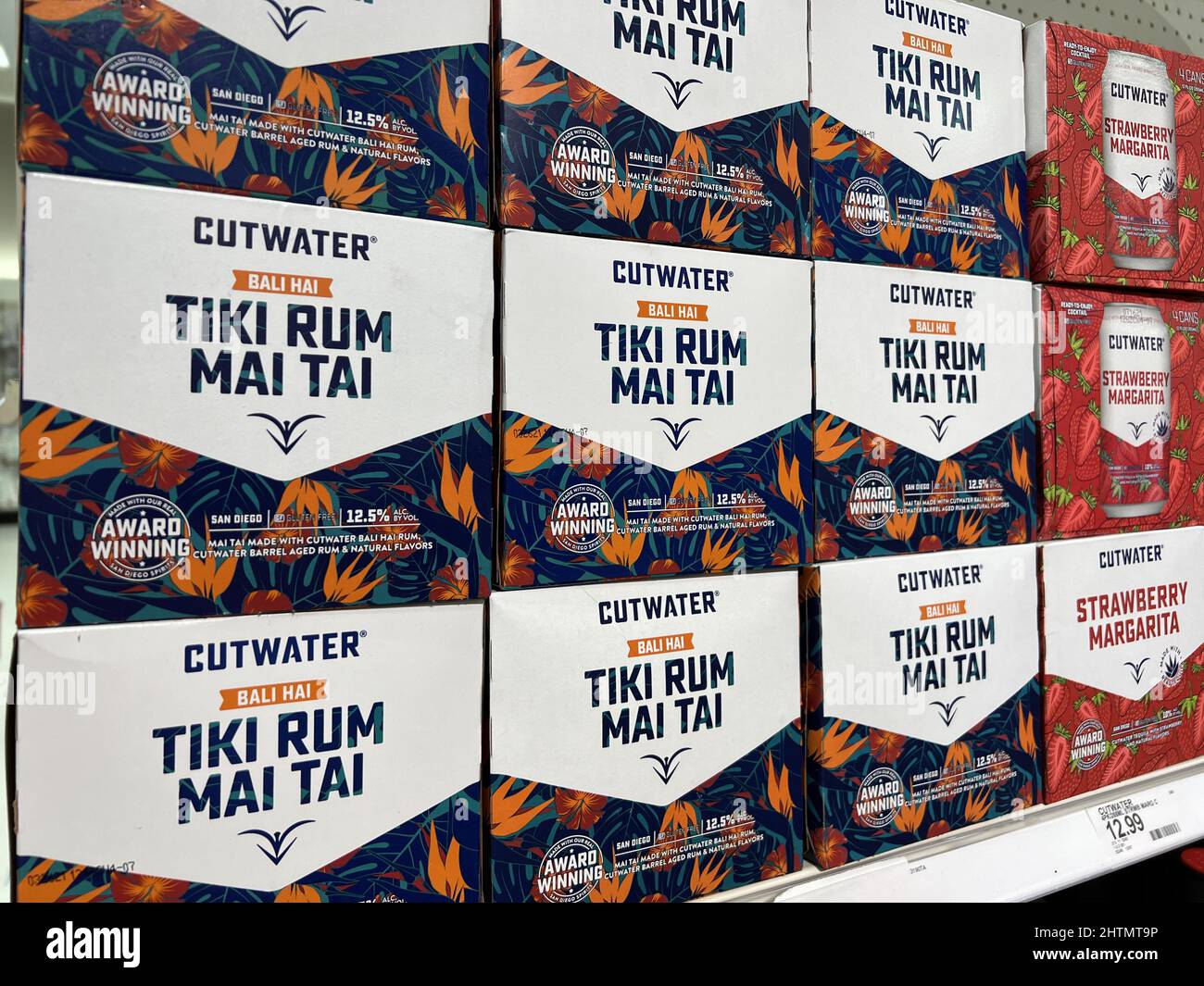 Boxes of Cutwater Tiki Rum Mai Tai canned cocktails in a retail store ...