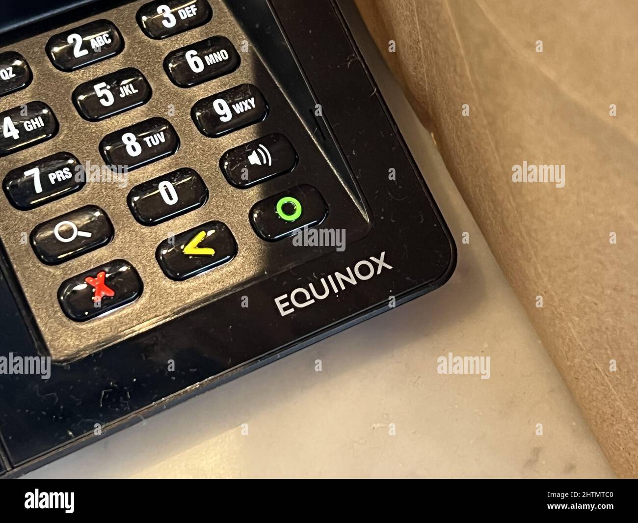 Logo for financial technology comapny Equinox Payments on a card reader ...