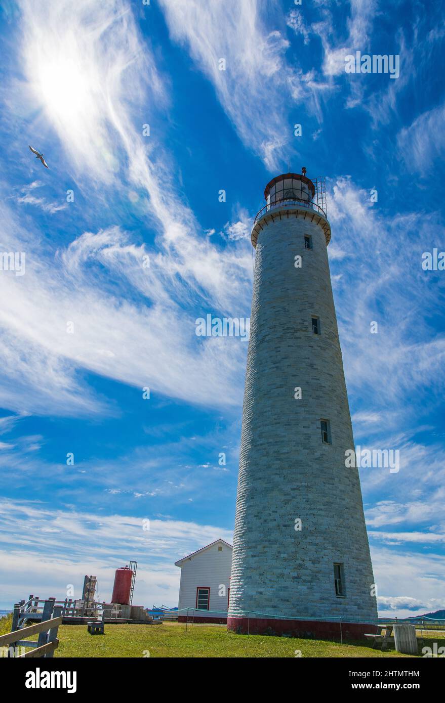 Vertical low angle shot of the Cap-aux-Rosiers Lighthouse in Gaspesie ...