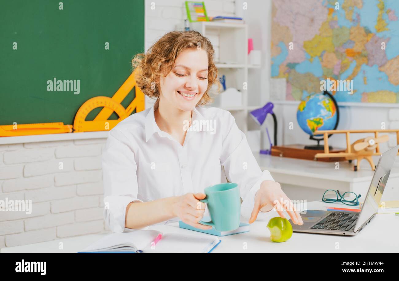 School teacher lunch. Eating in classroom. Education, study and ...