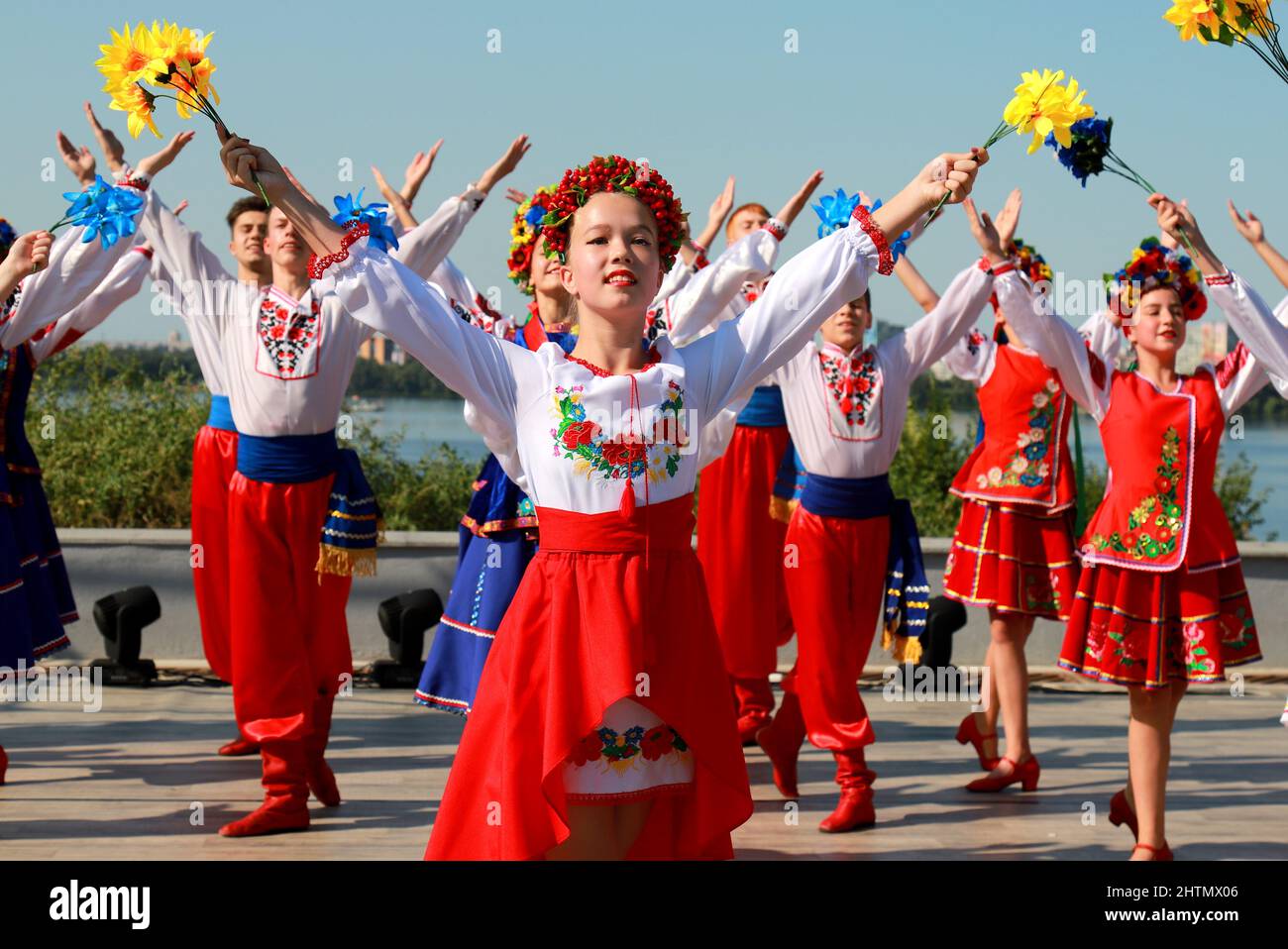 Young girls dance the national Ukrainian dance in folk costumes ...