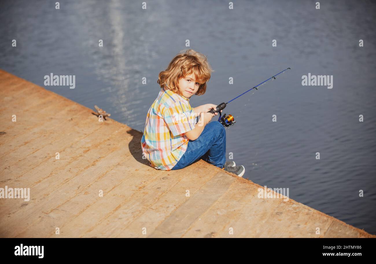 Young child fisher. Kid fishing at river bank, summer outdoor leisure ...