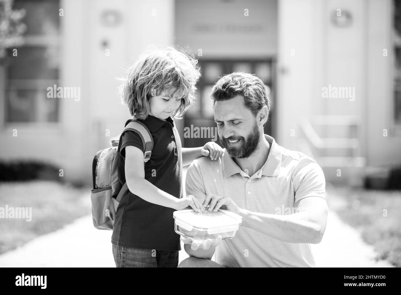 School lunch for kids. Father supports and motivates son. Schoolboy and ...