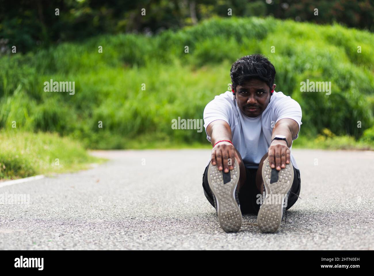 Close up Asian young athlete sport runner black man wear watch he ...