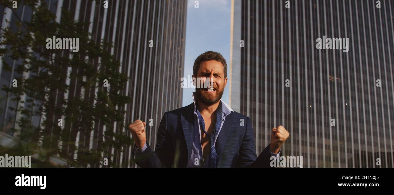 Amazed business man near office buildings. Sad businessman portrait ...