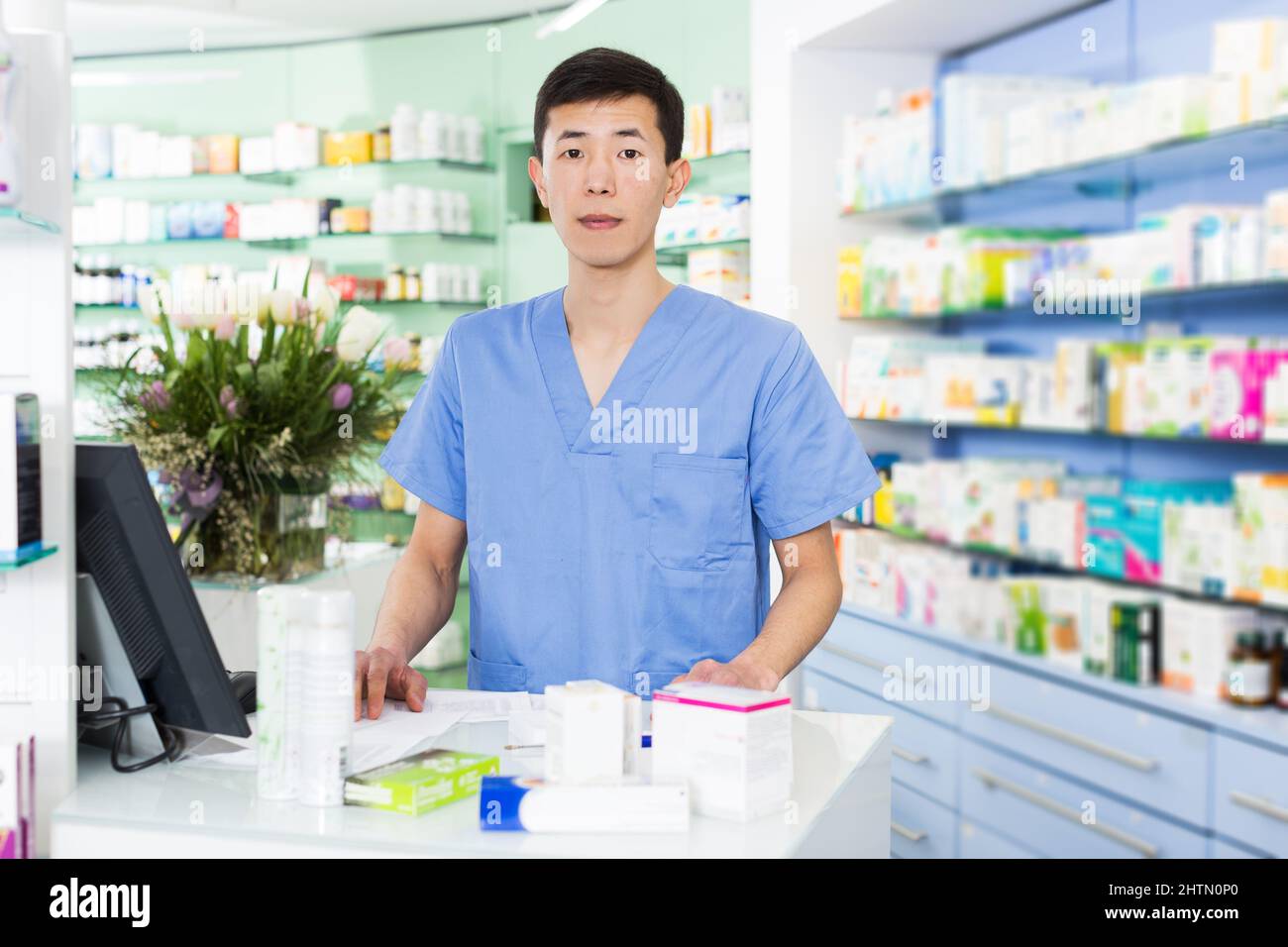 Happy japanese pharmacist standing hi-res stock photography and images ...