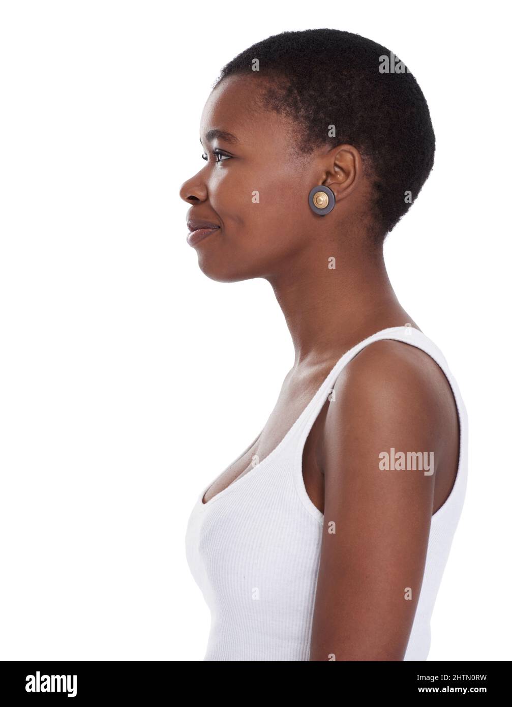 Looking forward to her future. Profile shot of a smiling young woman ...