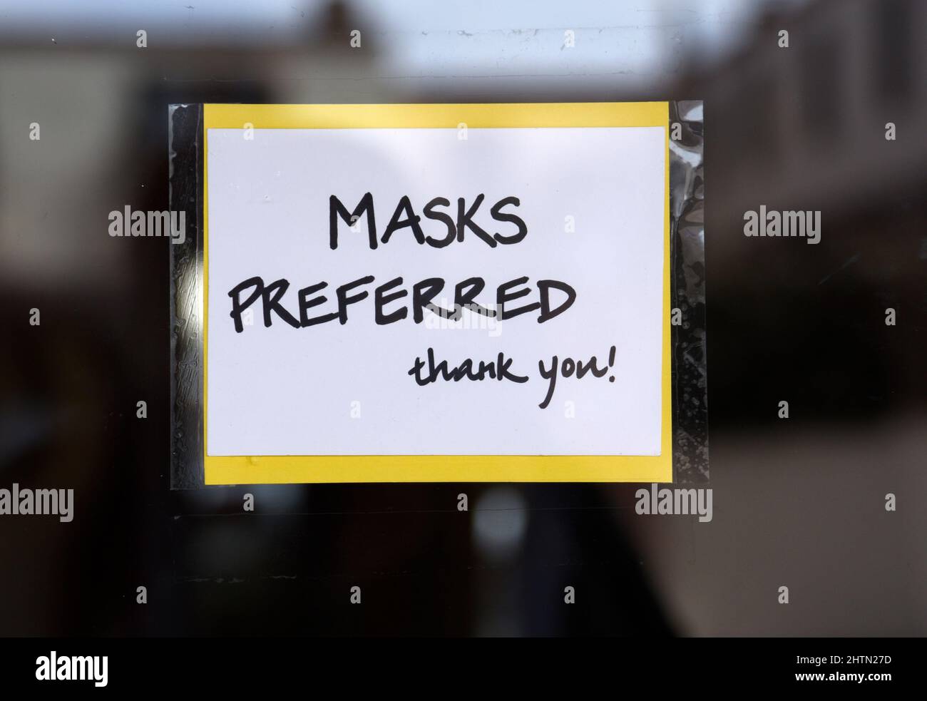 A sign on a shop in Santa Fe, New Mexico, requests customers to wear ...