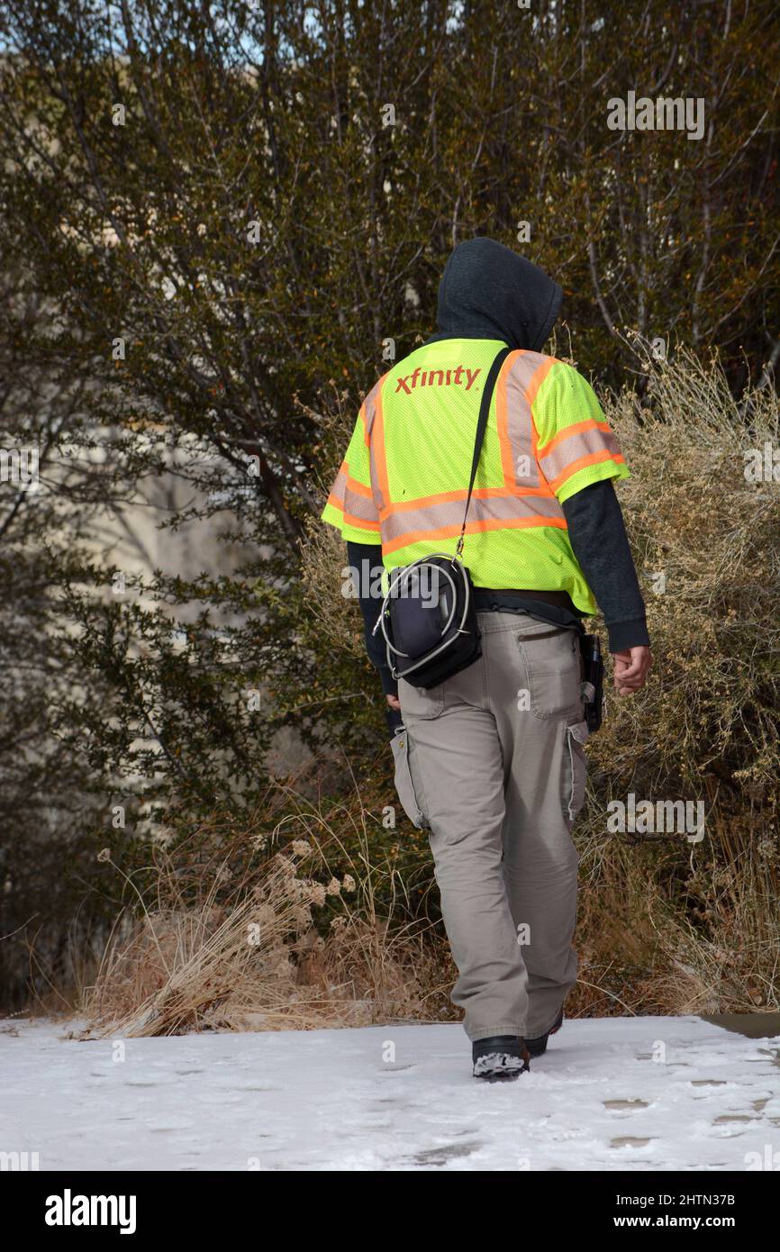 An Xfinity service technician begins work on installing a cable ...