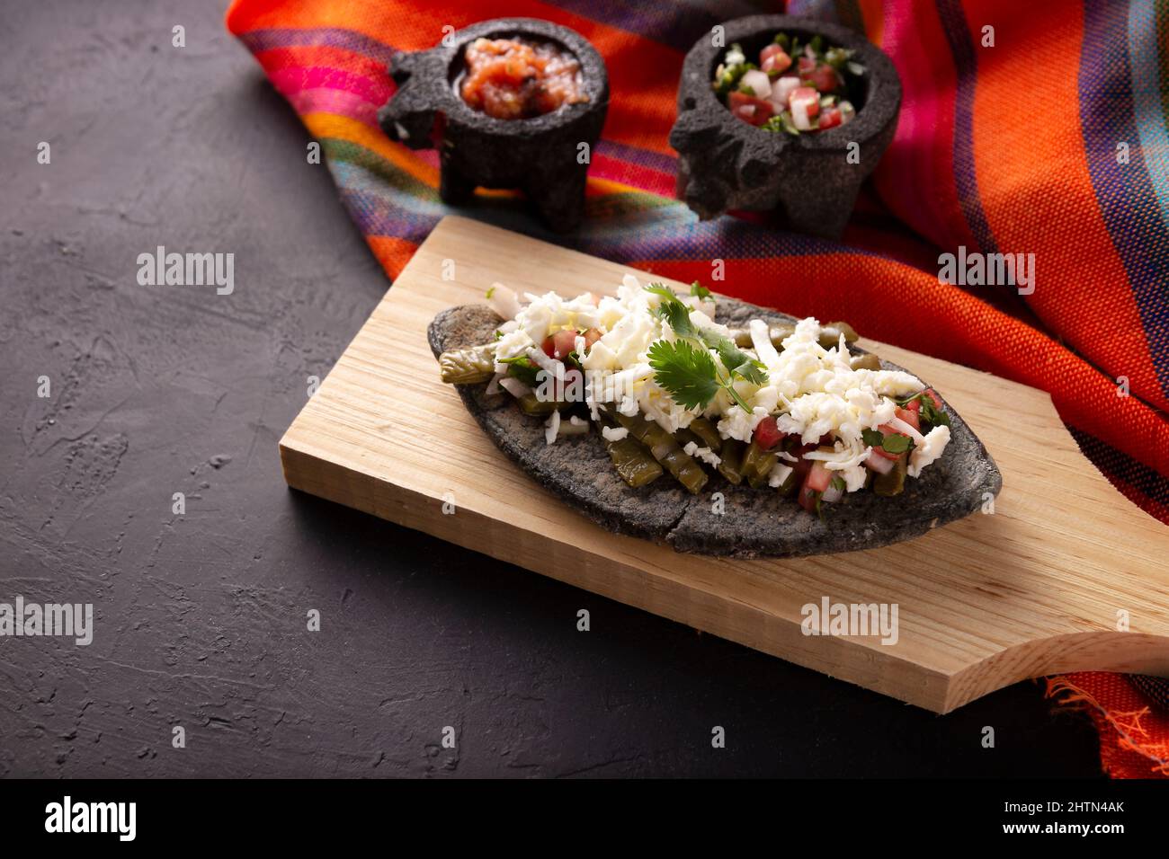 Tlacoyo with Nopales and salsa. Mexican pre hispanic dish made of blue ...