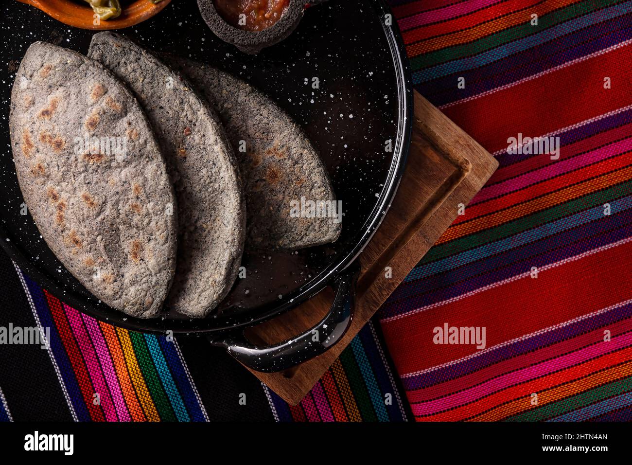 Comal de Peltre con Tlacoyos. Mexican pre hispanic dish made of blue ...