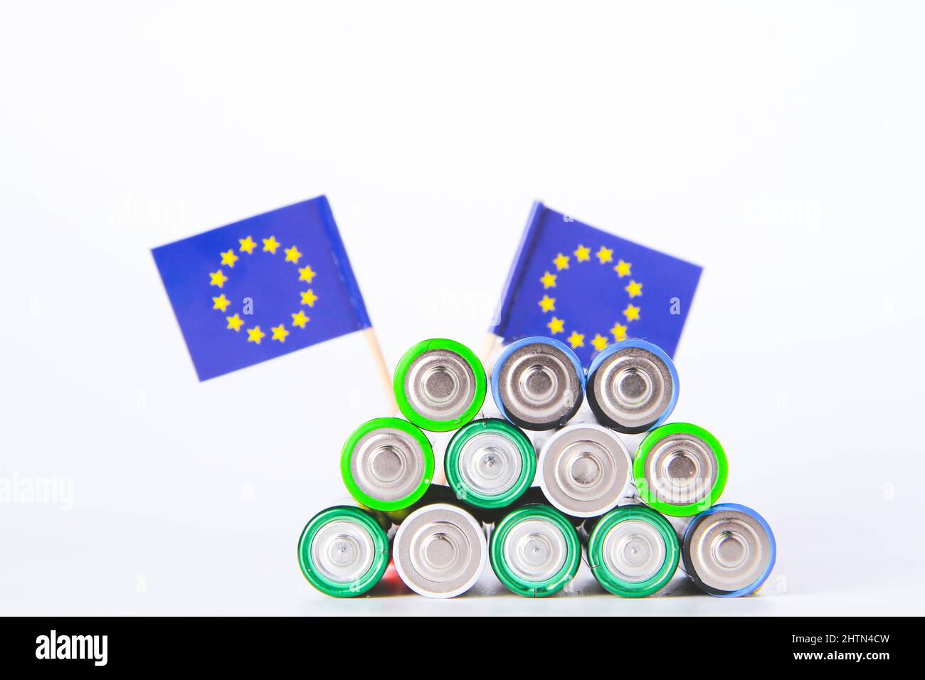 Battery. AA lot of batteries on the background of the flag of the ...
