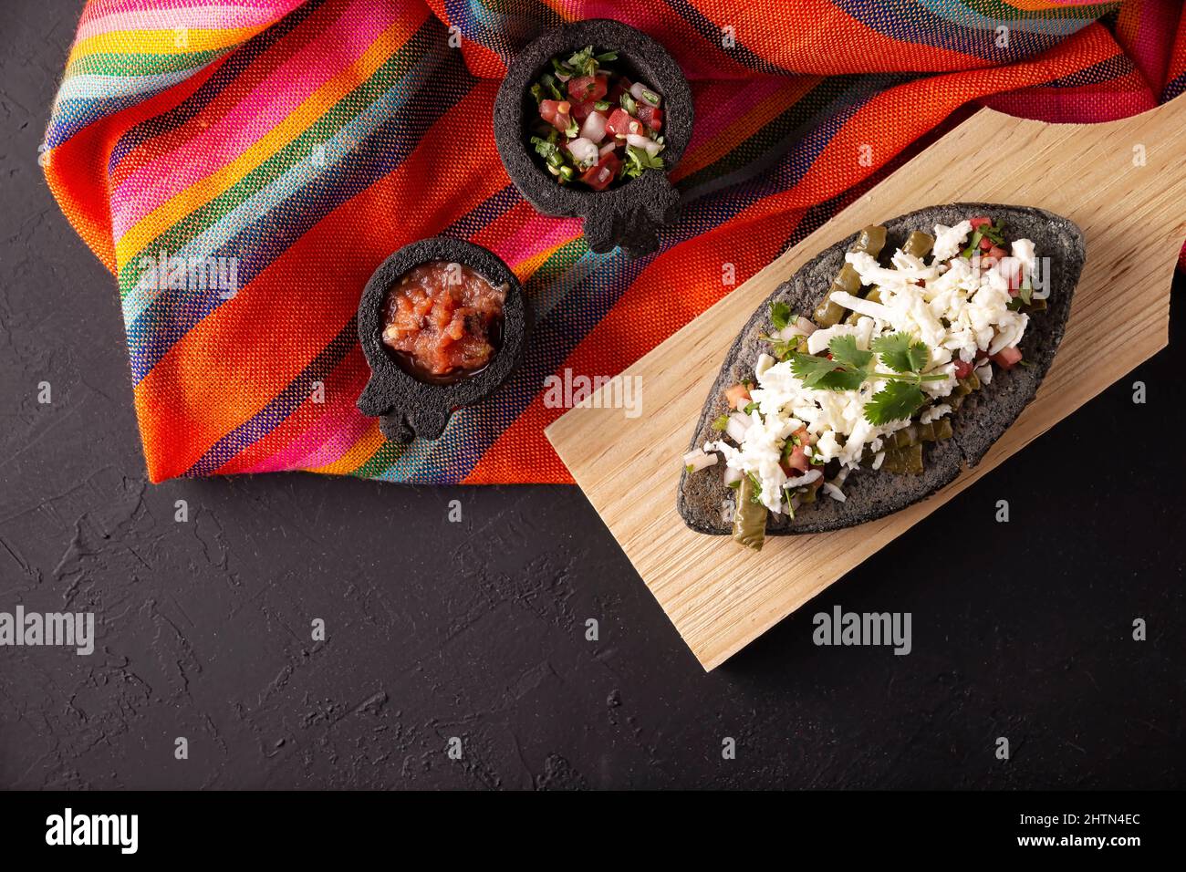 Tlacoyo with Nopales and Cheese. Mexican pre hispanic dish made of blue ...