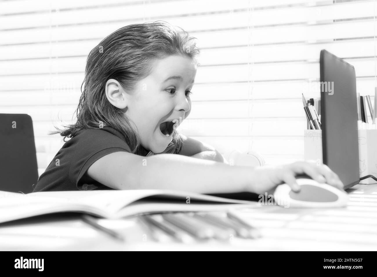 Schoolboy pupil kid studying online using laptop. Child attending ...