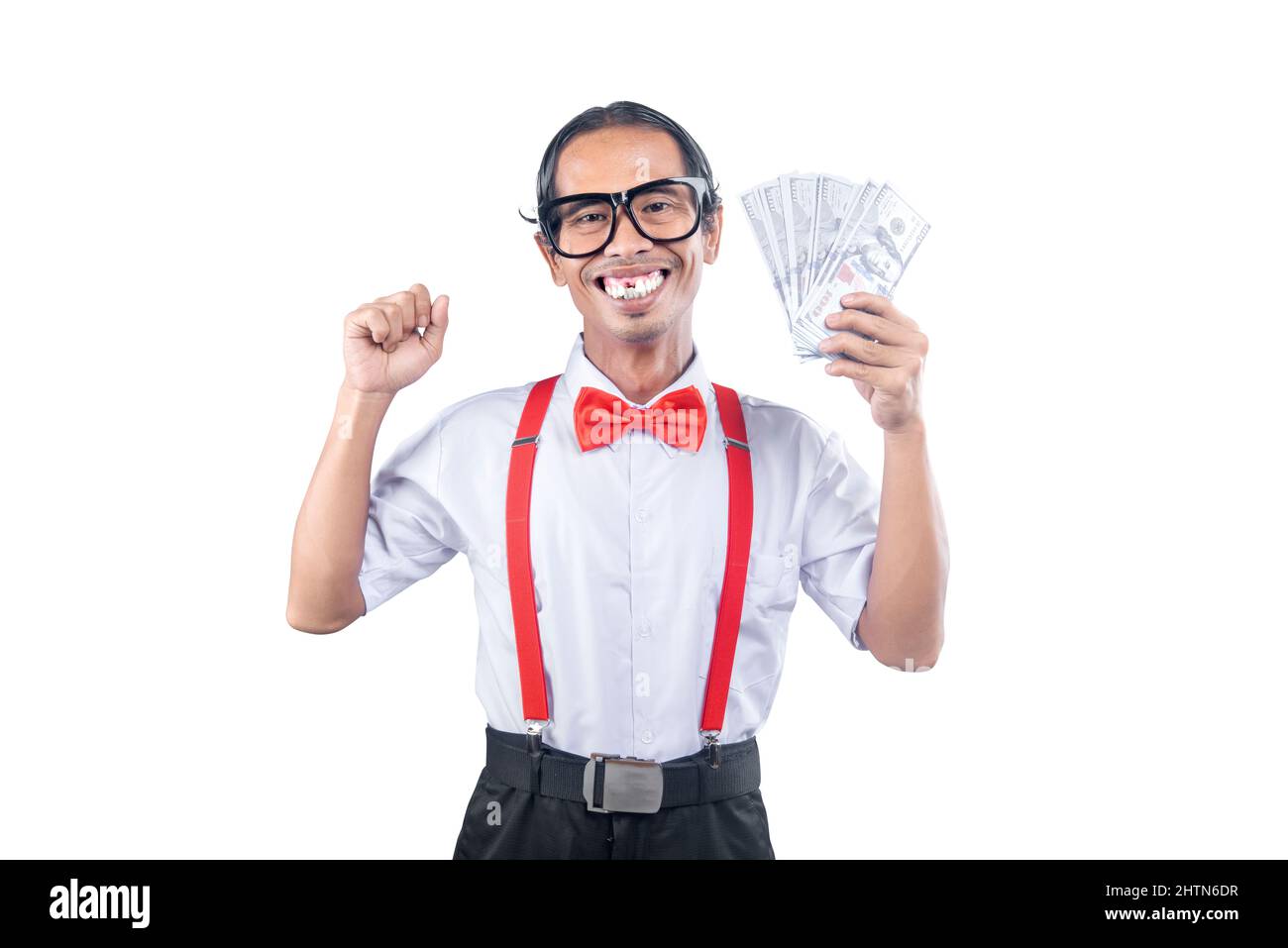 Asian nerd with an ugly face holding money isolated over white ...