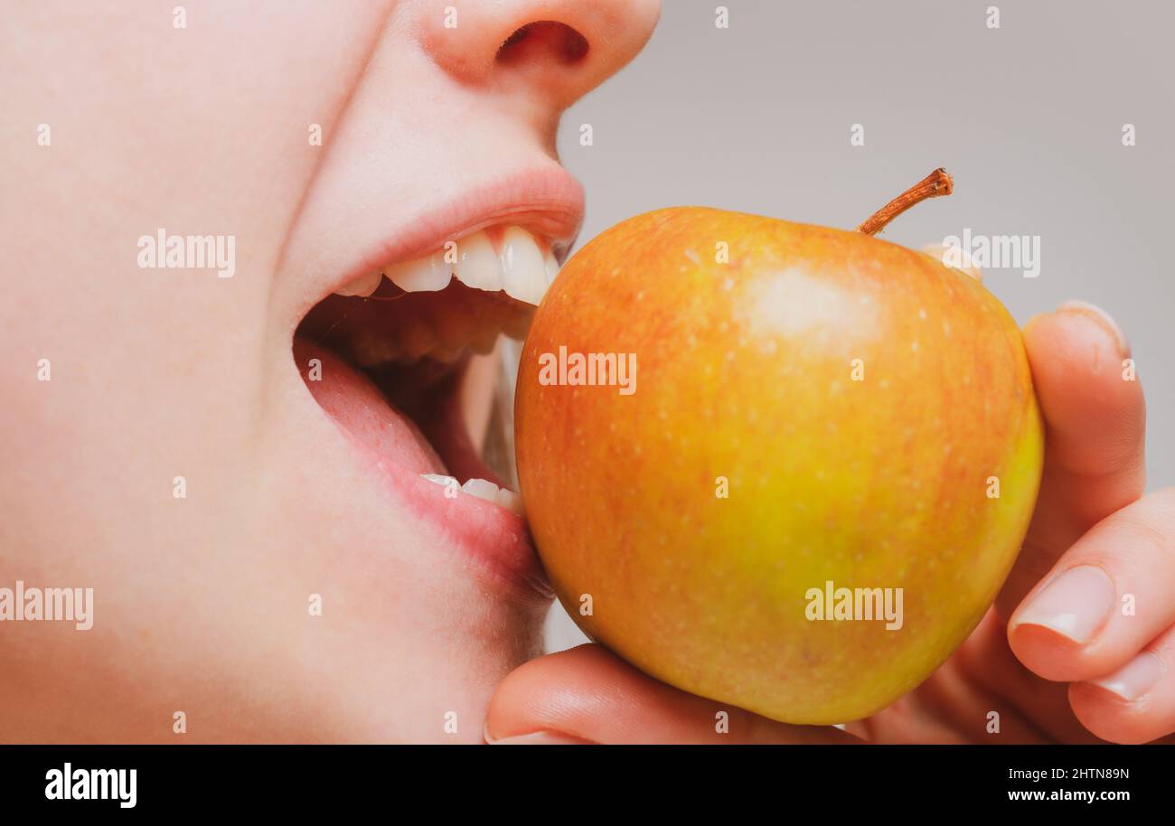Healthy teeth and apple. Dental care. Woman biting an apple. Mouth ...
