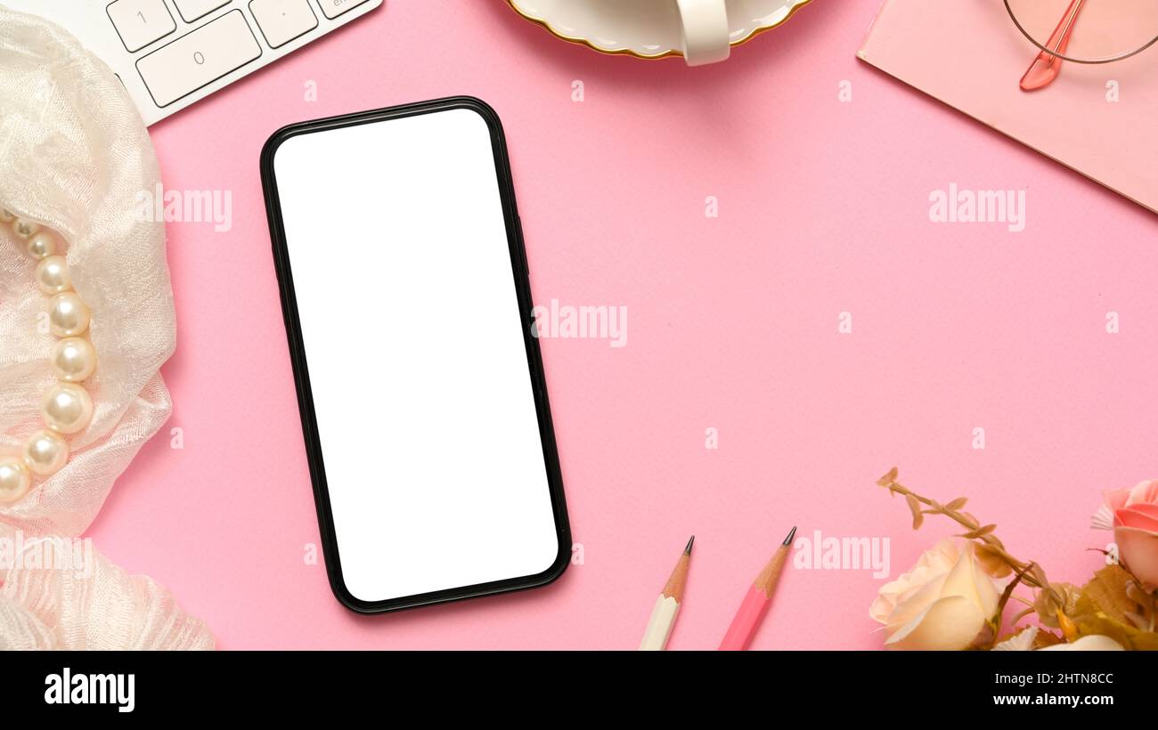 Beautiful pink office desk background with smartphone blank screen ...