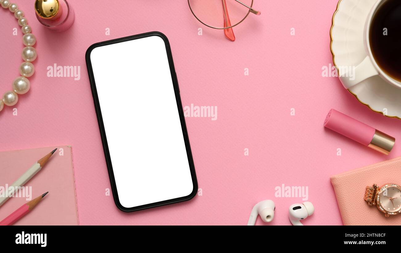 Feminine office desk with a cup of black coffee, eyeglasses, stationery ...