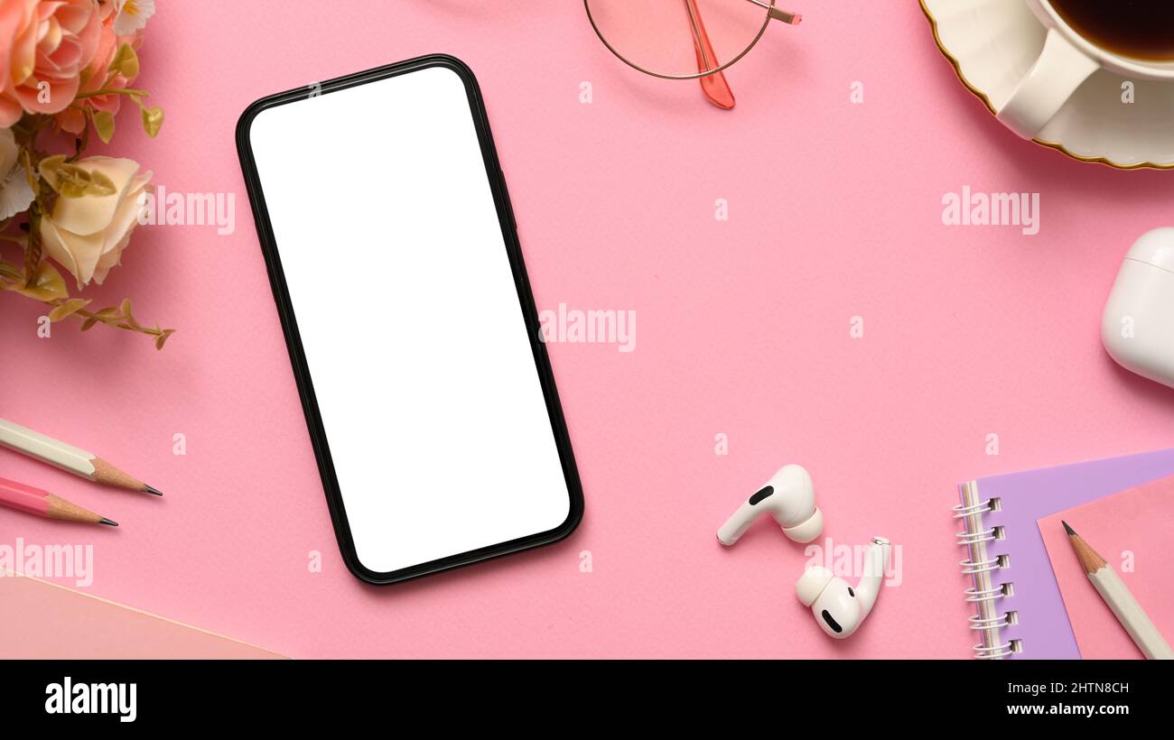 Pink office desk workspace with smartphone white screen mockup and ...