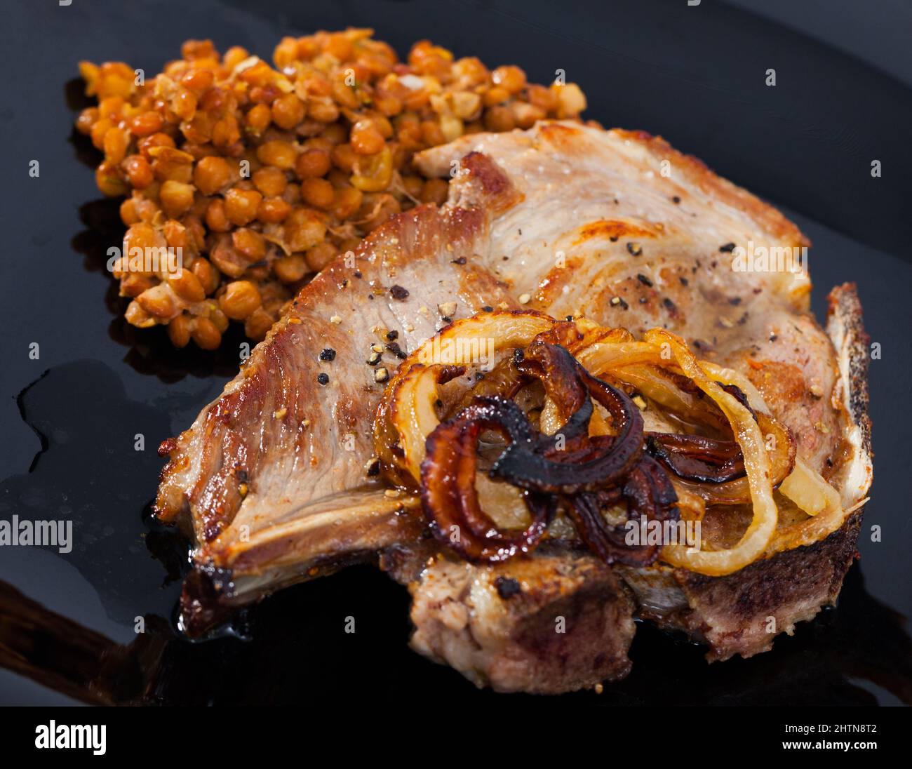 Roasted pork shin with lentils Stock Photo - Alamy
