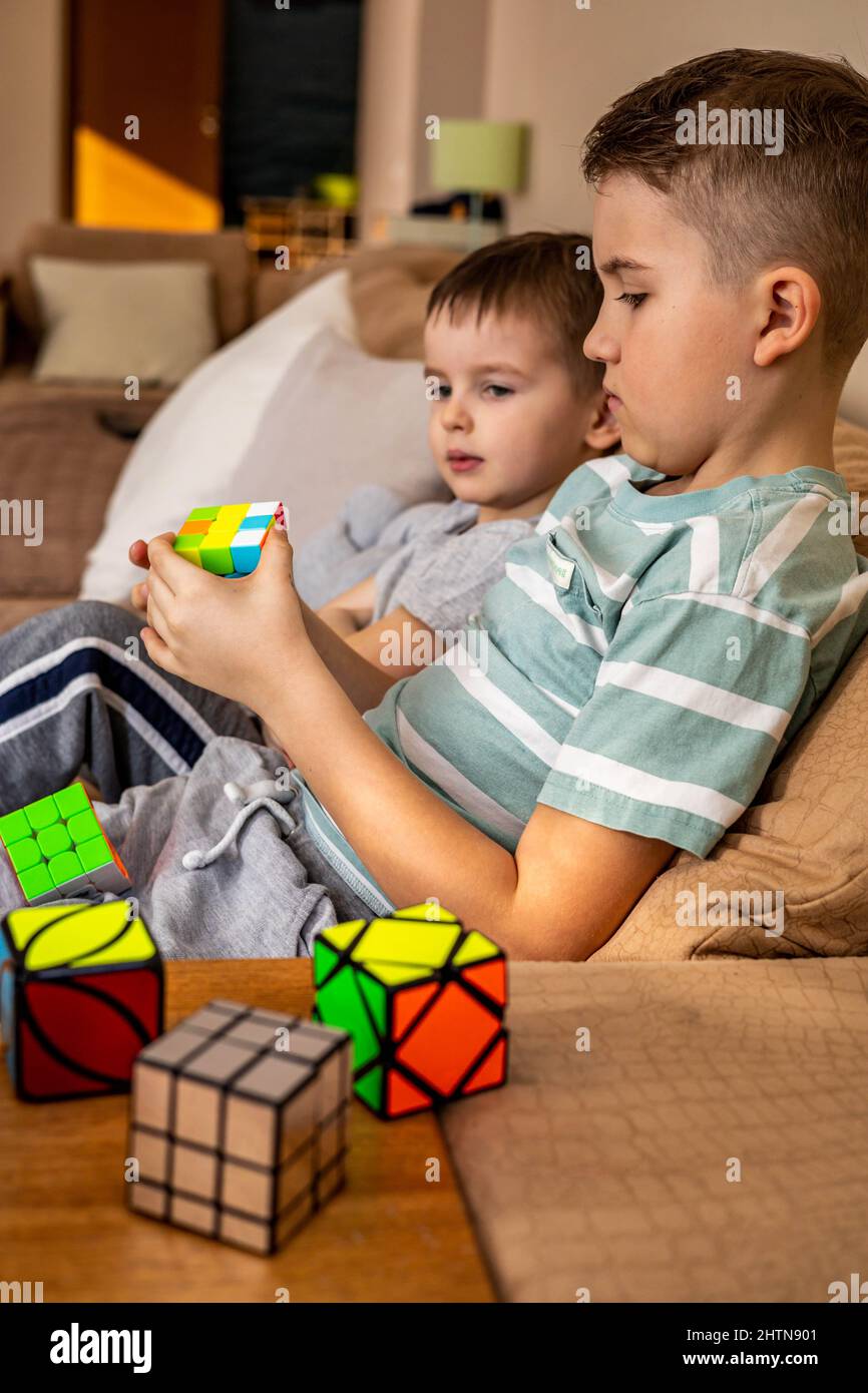 Kid solving rubik's cube hi-res stock photography and images - Alamy