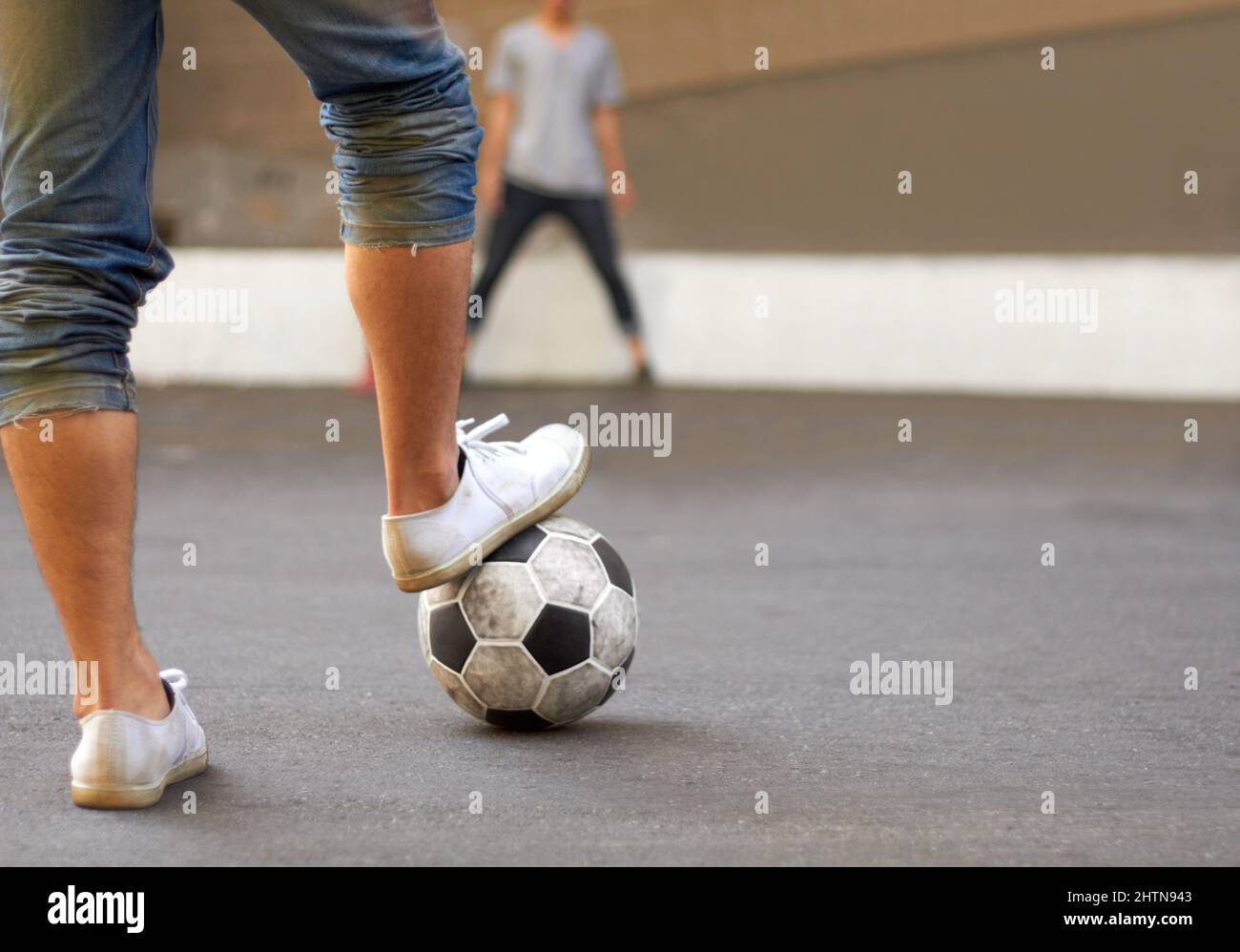 Ready to score. Cropped image of a mans foot on a soccer ball in the ...