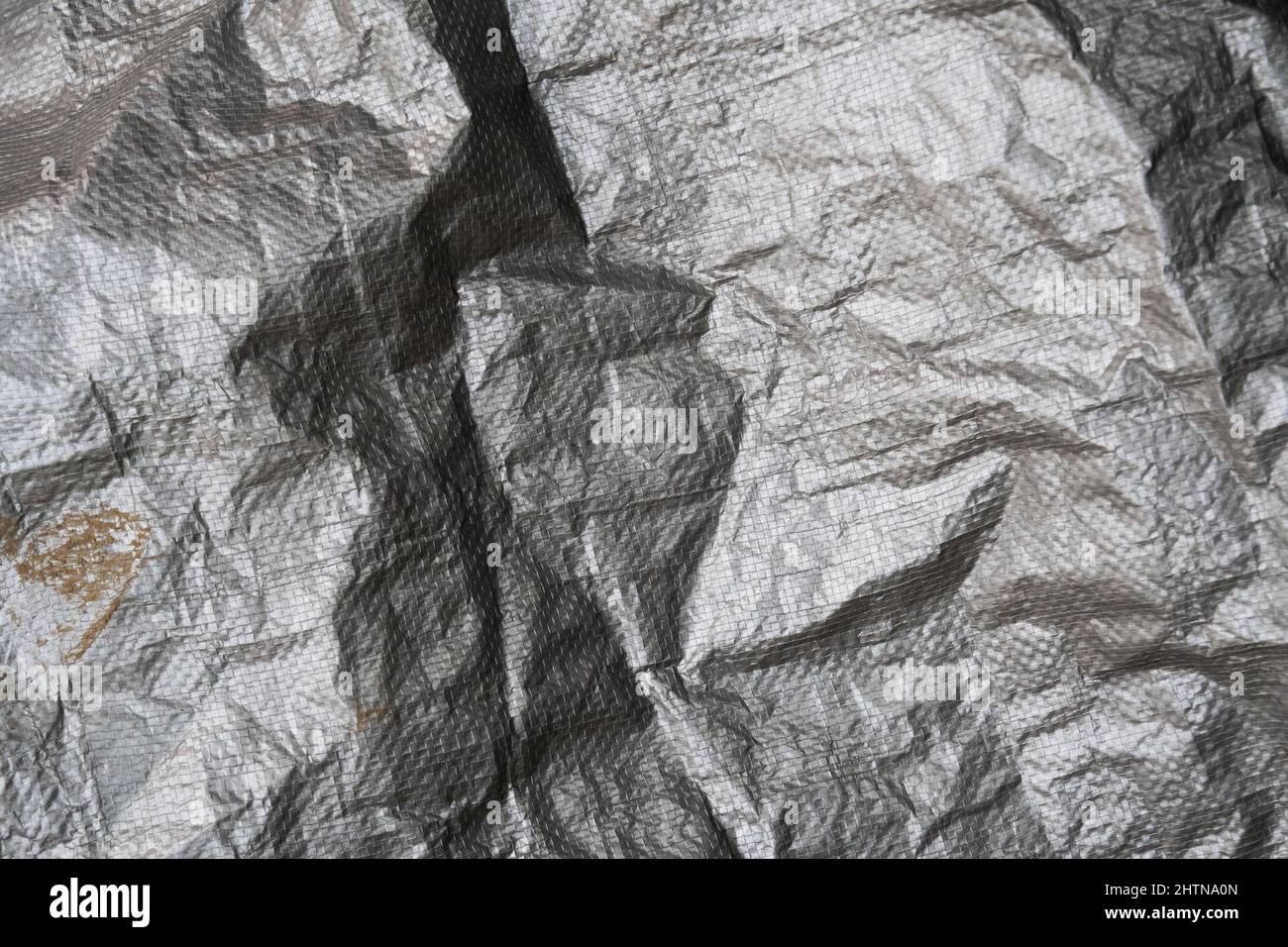 Silver tarp dirty and wrinkled texture background Stock Photo - Alamy