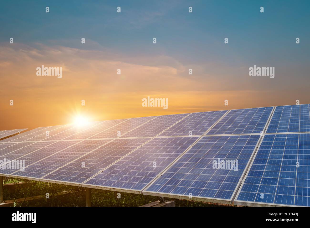 Solar panel at beautiful sunset sky background. Photovoltaic ...