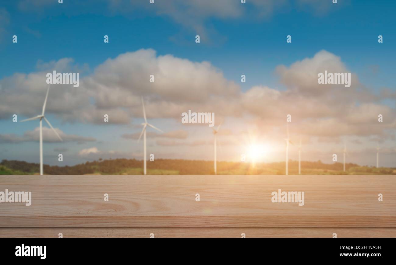 empty wooden tabletop over blur wind turbine field background Stock ...