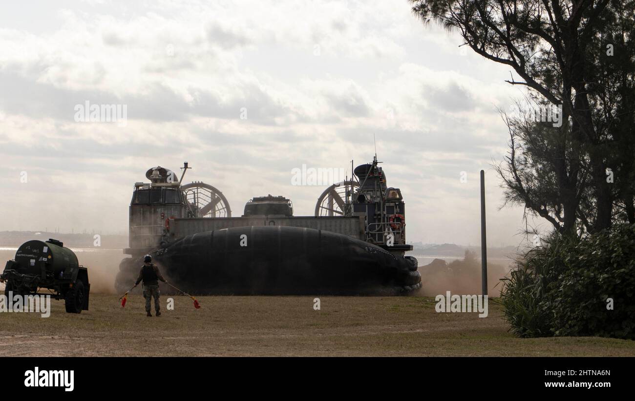 A U.S. Navy landing craft, air cushion with Naval Beach Unit 7 comes ...
