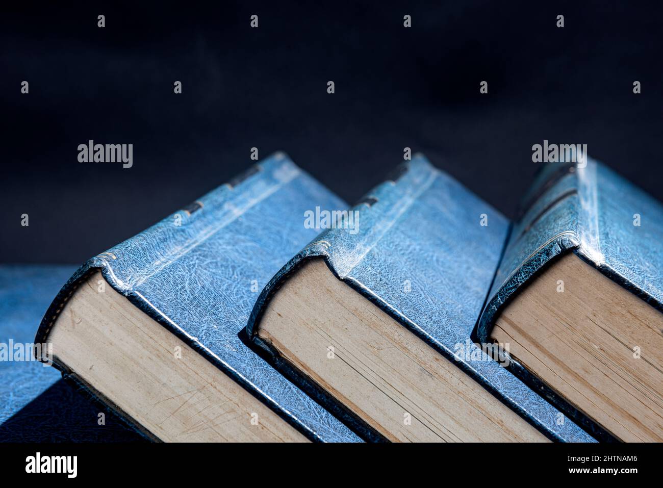 Stack of books with dark background Stock Photo - Alamy