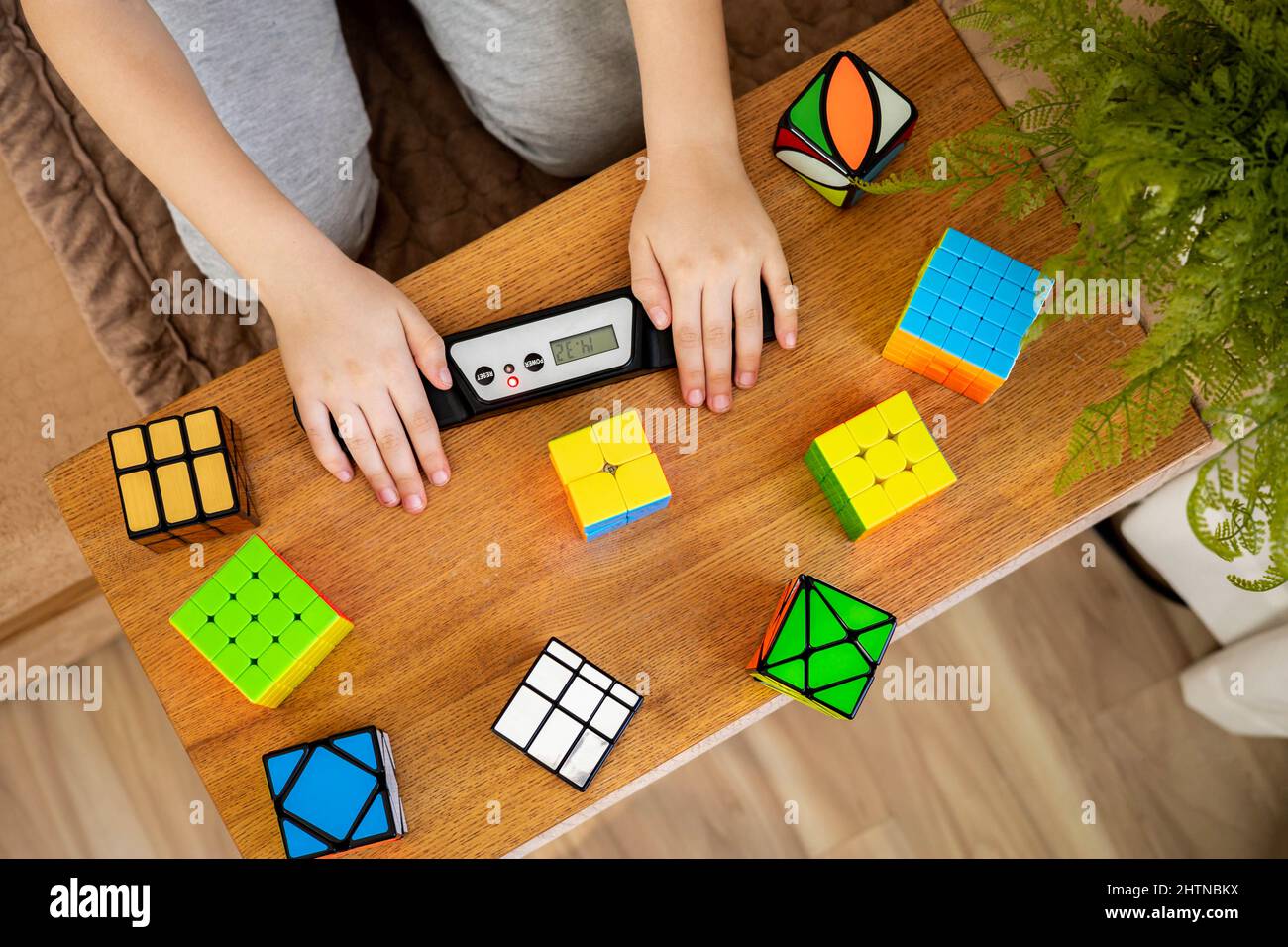 Closeup top view male adolescent hands checking time of assembling ...