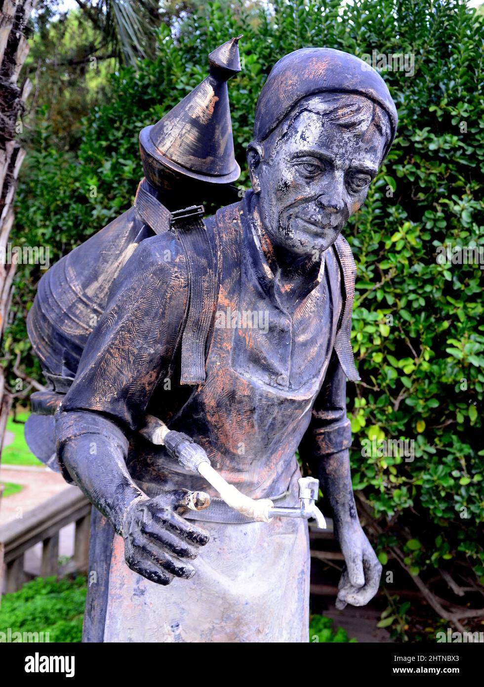 Metal statue of man carrying water vessel in Karaalioğlu Park (Turkish ...