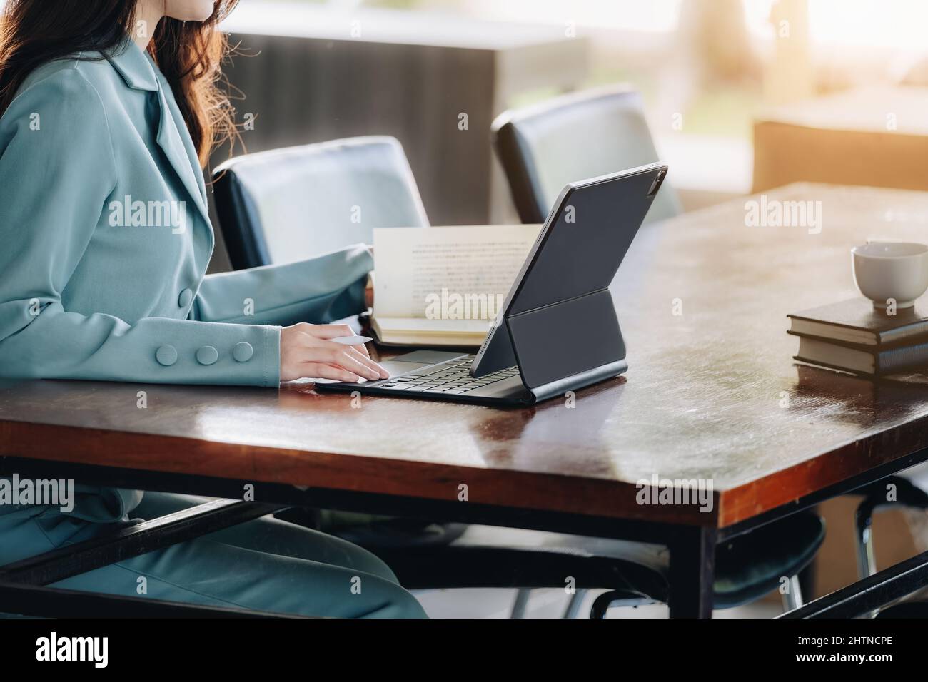 A female entrepreneur or businesswoman showing a smiling face while ...