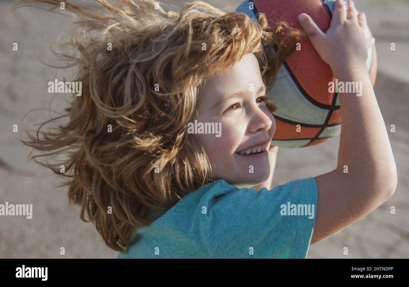 Excited funny kid playing basketball. Closeup child portrait. Funny ...