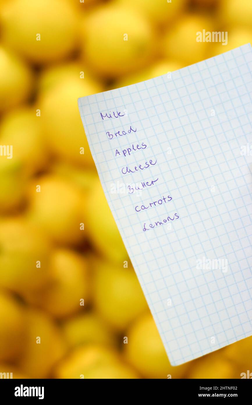 Stick to a healthy list. Cropped shot of a grocery list with basic ...