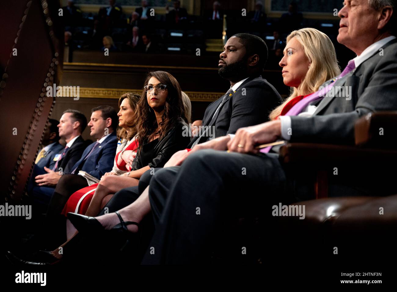Representative Lauren Boebert (R-CO) (C) looks on as US President Joe ...