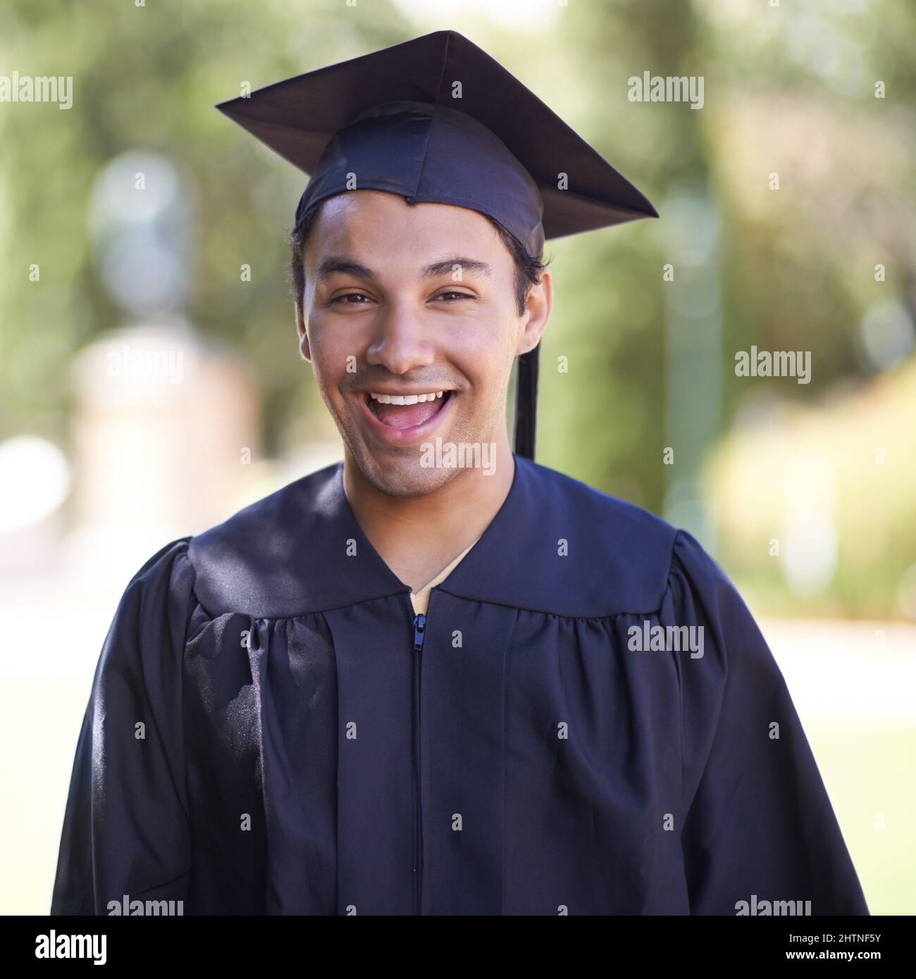 So happy. Portrait of a happy graduate male Stock Photo - Alamy