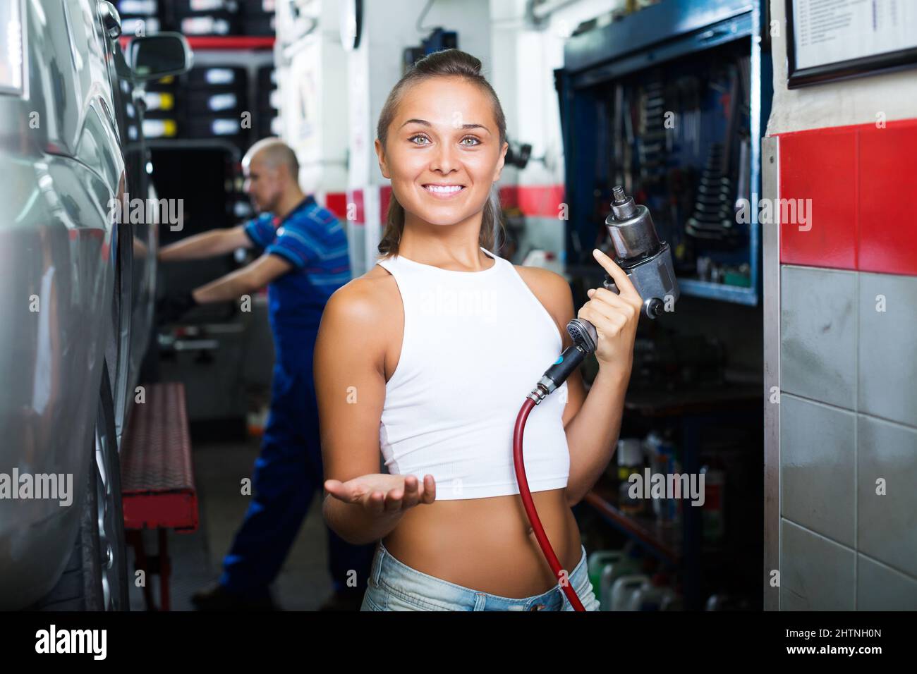 Girl working as auto mechanic Stock Photo - Alamy