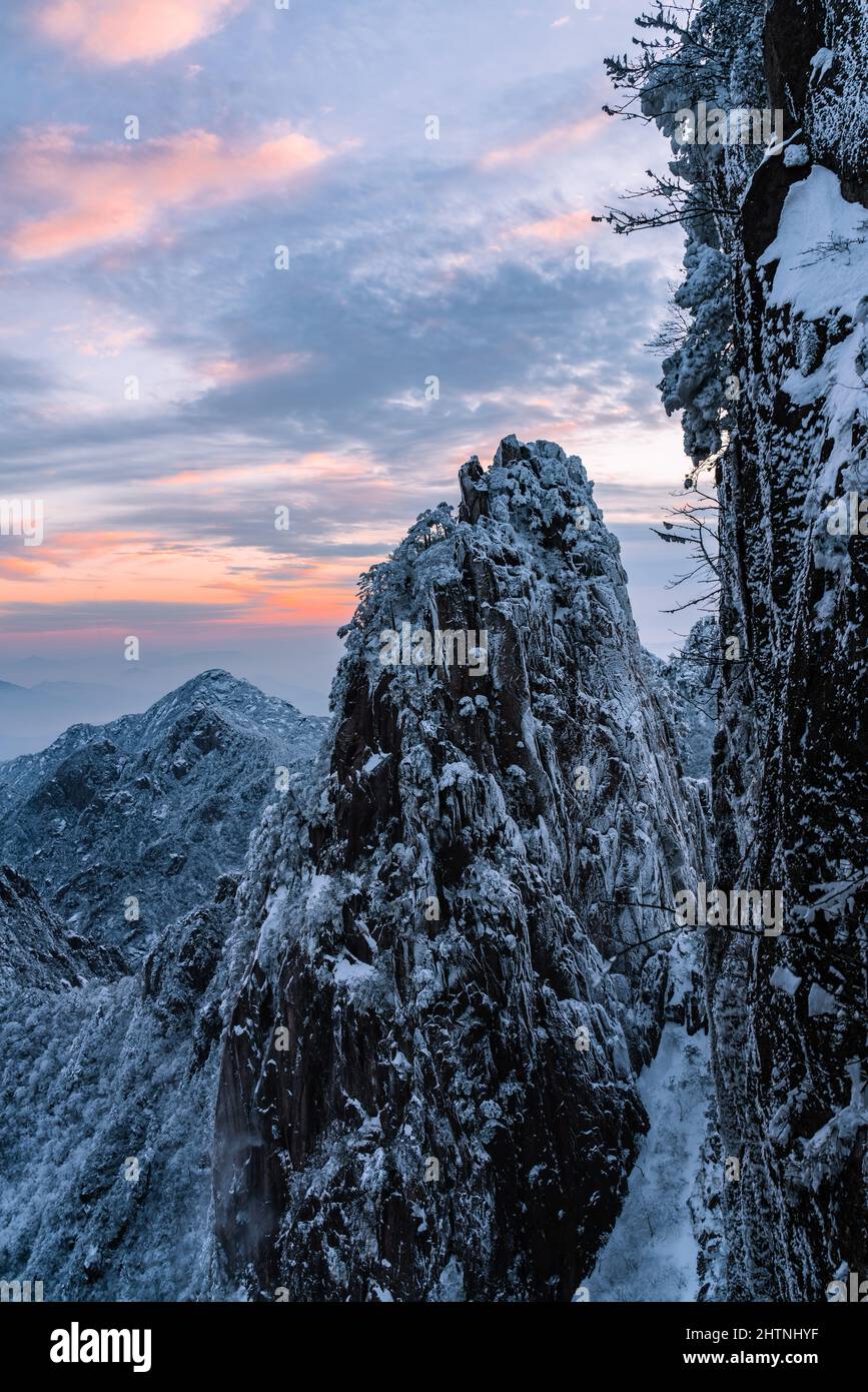 Sunrise view of the Yellow Mountain in winter, with snow, Anhui ...