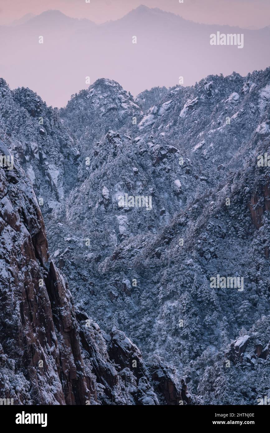 Sunrise view of the Yellow Mountain in winter, with snow, Anhui ...