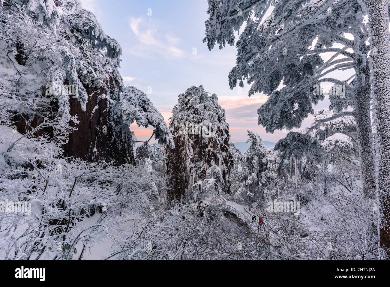 Sunrise view of the Yellow Mountain in winter, with snow, Anhui ...