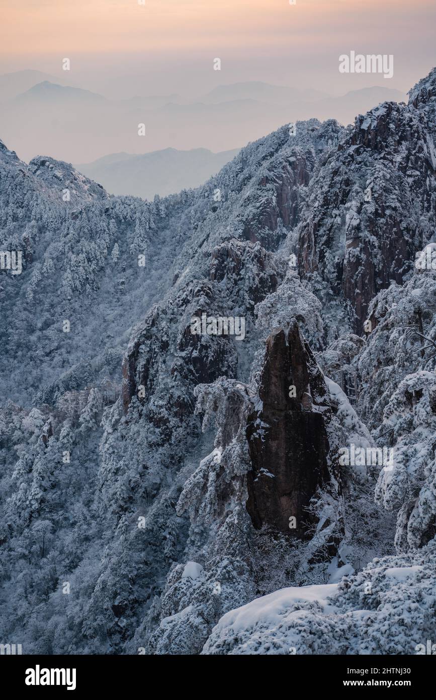 Sunrise view of the Yellow Mountain in winter, with snow, Anhui ...